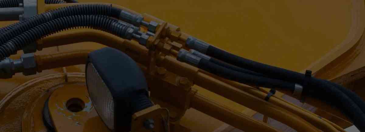 The causes and impacts of hydraulic fluid contamination on heavy equipment